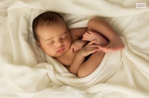 The Newborn Scrunch: What It Is and Why It’s So Adorable